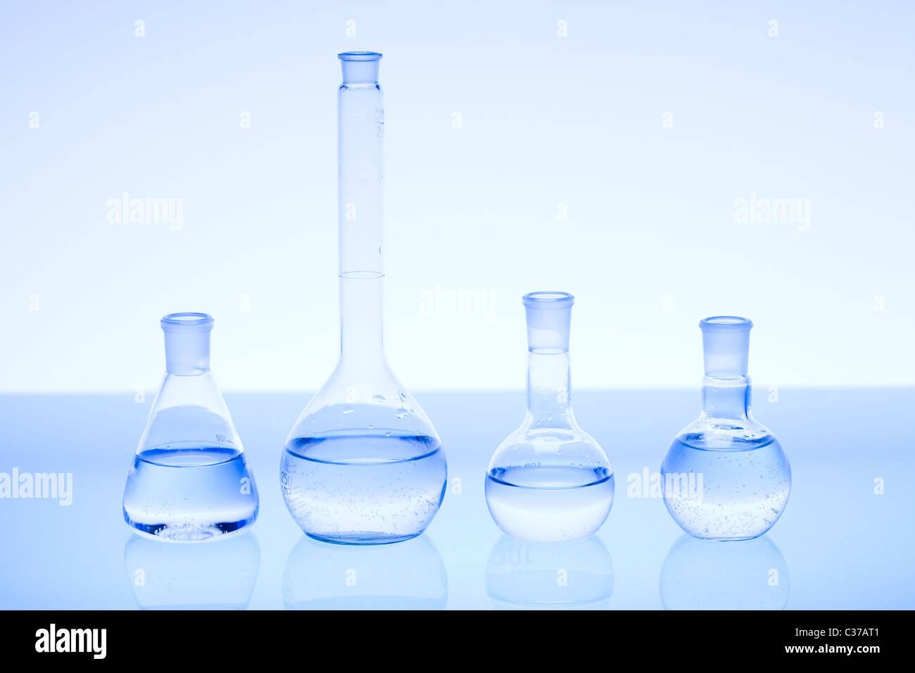 Laboratory glass in blue scenery Stock Photo - Alamy