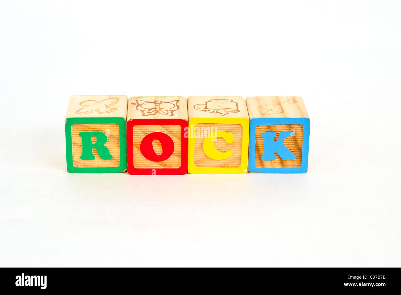 Vintage alphabet blocks spelling out ROCK Stock Photo - Alamy