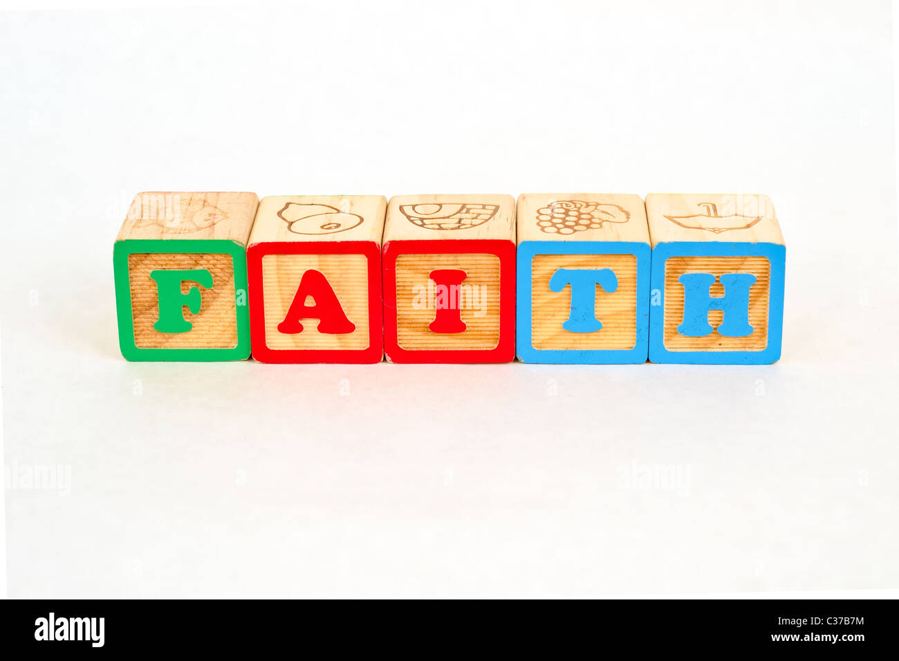 Vintage alphabet blocks spelling out FAITH Stock Photo - Alamy