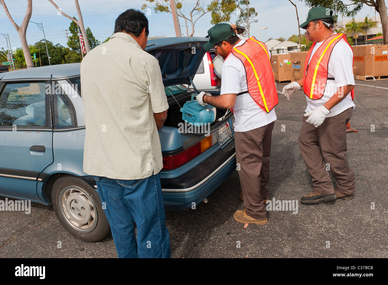 Recycling workers help in the collection, sorting, and packing of ...