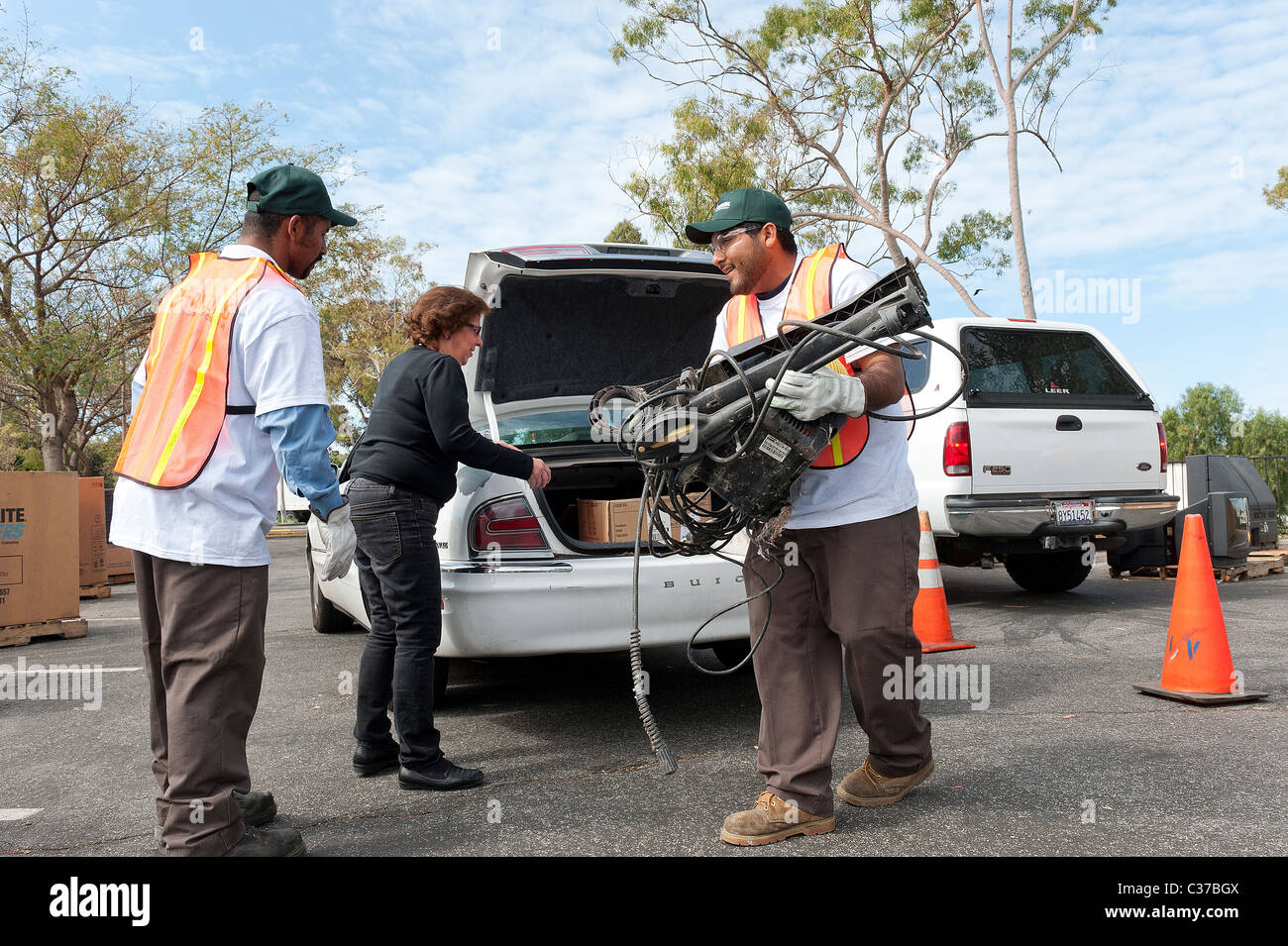 Recycling workers help in the collection, sorting, and packing of ...