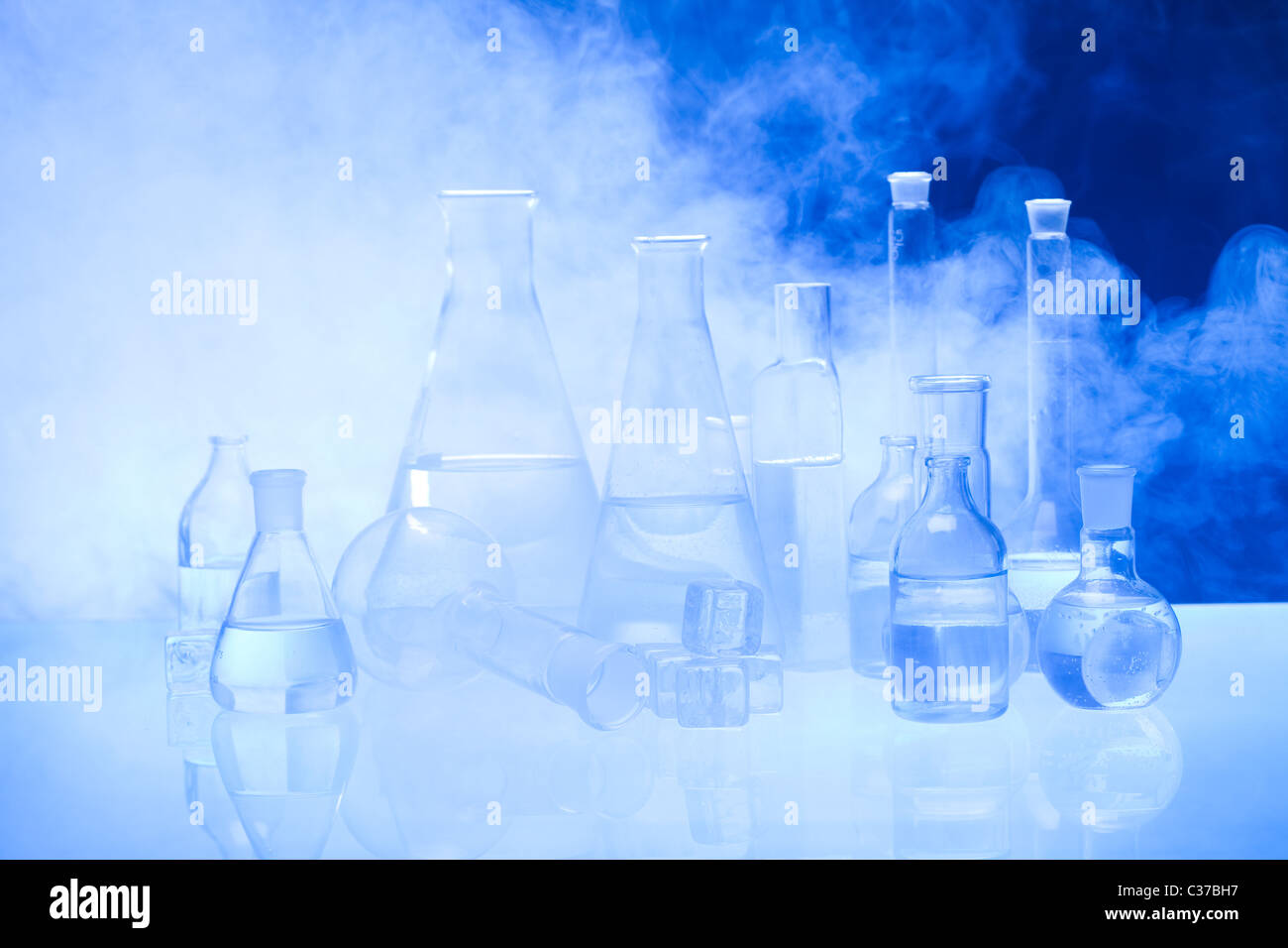 Laboratory glass in blue scenery Stock Photo - Alamy