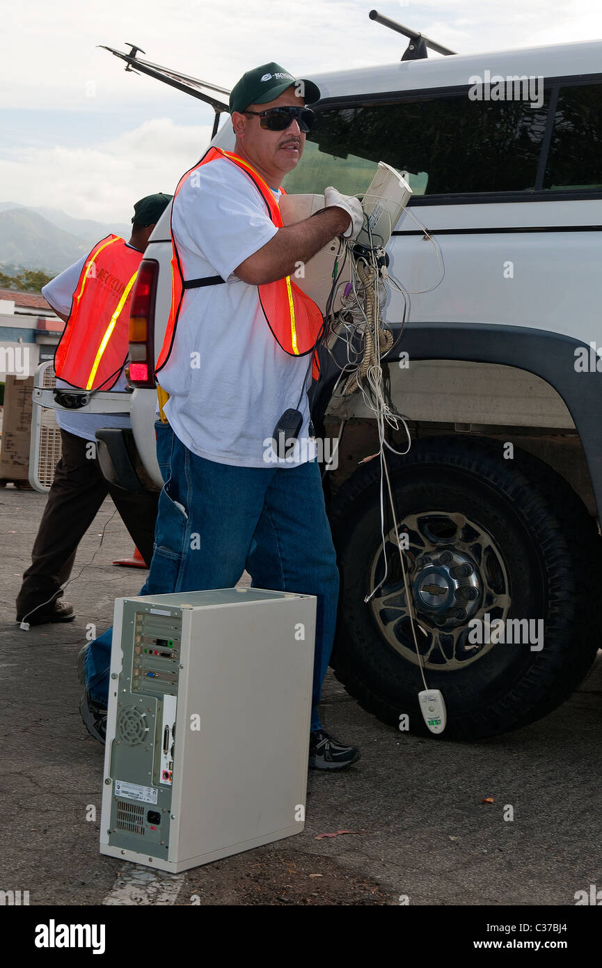 Recycling workers help in the collection, sorting, and packing of ...