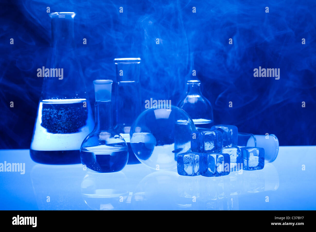 Laboratory glass in blue scenery Stock Photo - Alamy