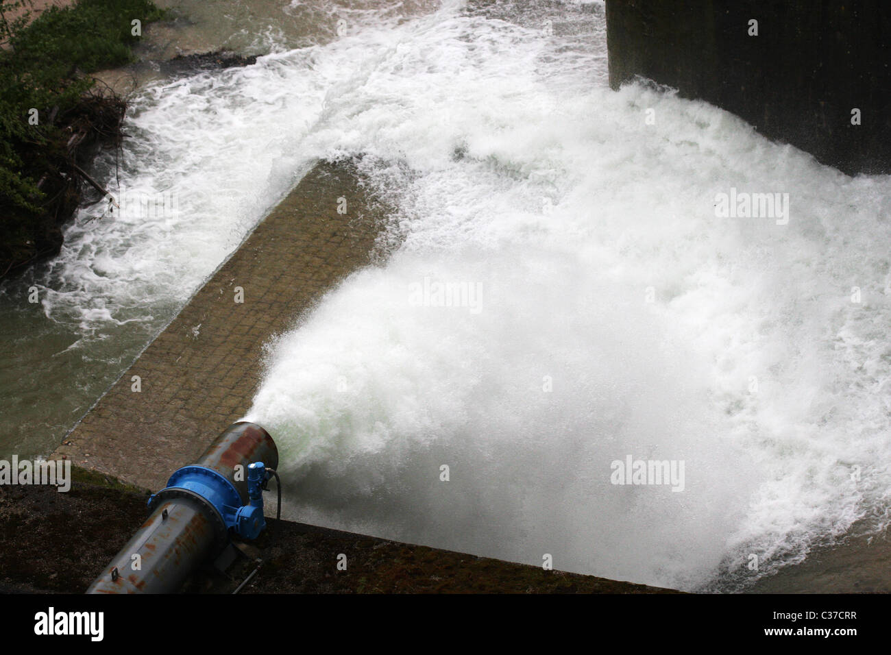 Water gushing from a pipe under great pressure Stock Photo - Alamy