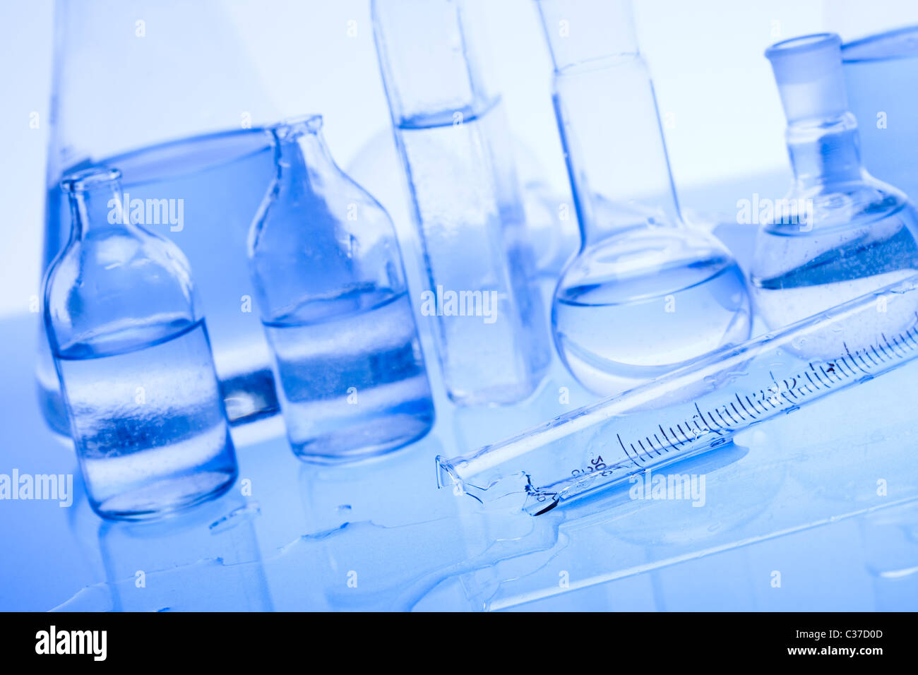 Laboratory glass in blue scenery Stock Photo - Alamy