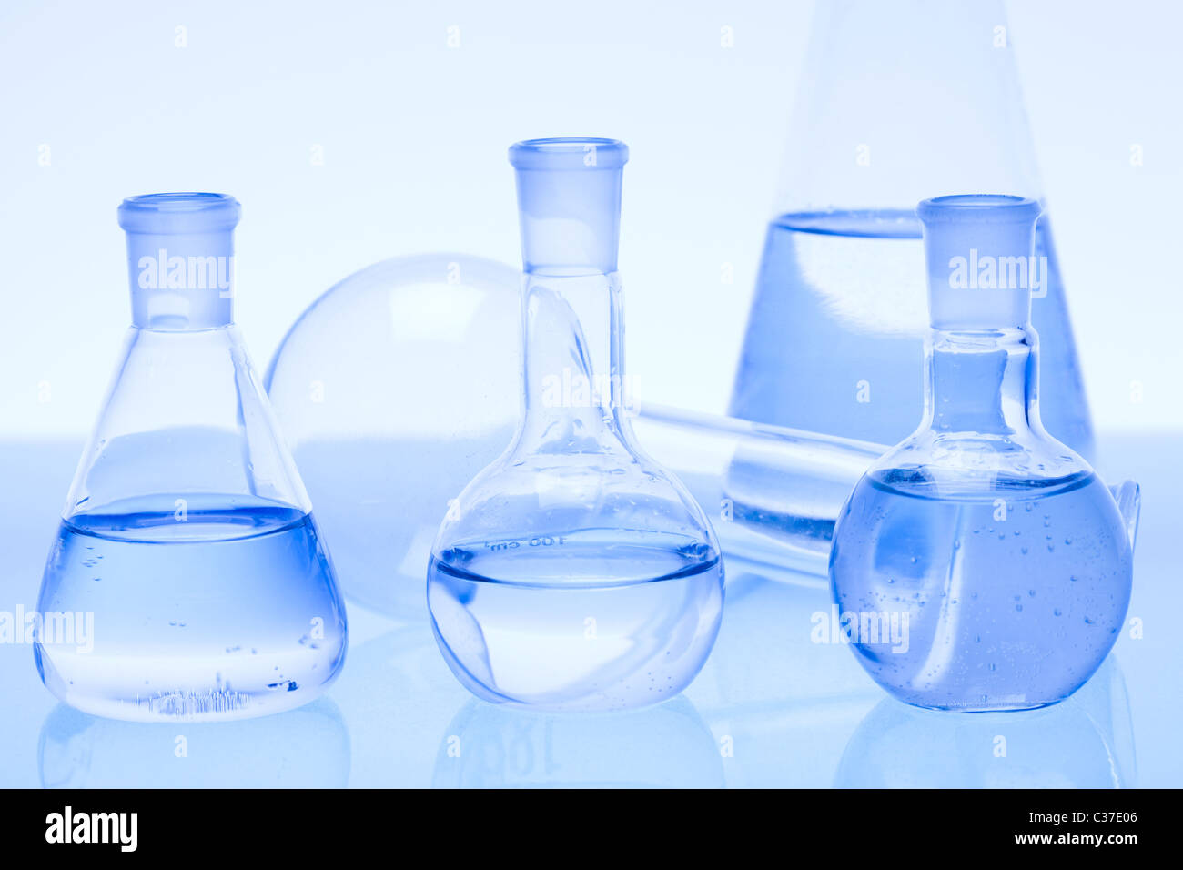 Laboratory glass in blue scenery Stock Photo - Alamy