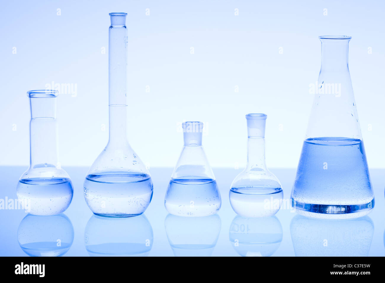 Laboratory glass in blue scenery Stock Photo - Alamy