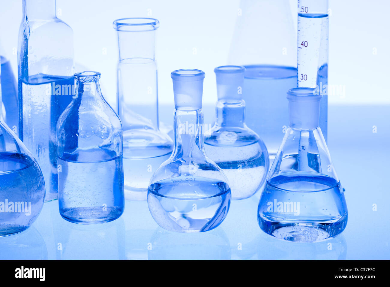 Laboratory glass in blue scenery Stock Photo - Alamy
