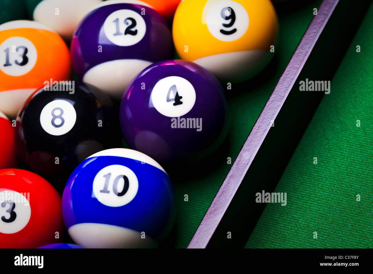 Billiard balls over green table Stock Photo - Alamy