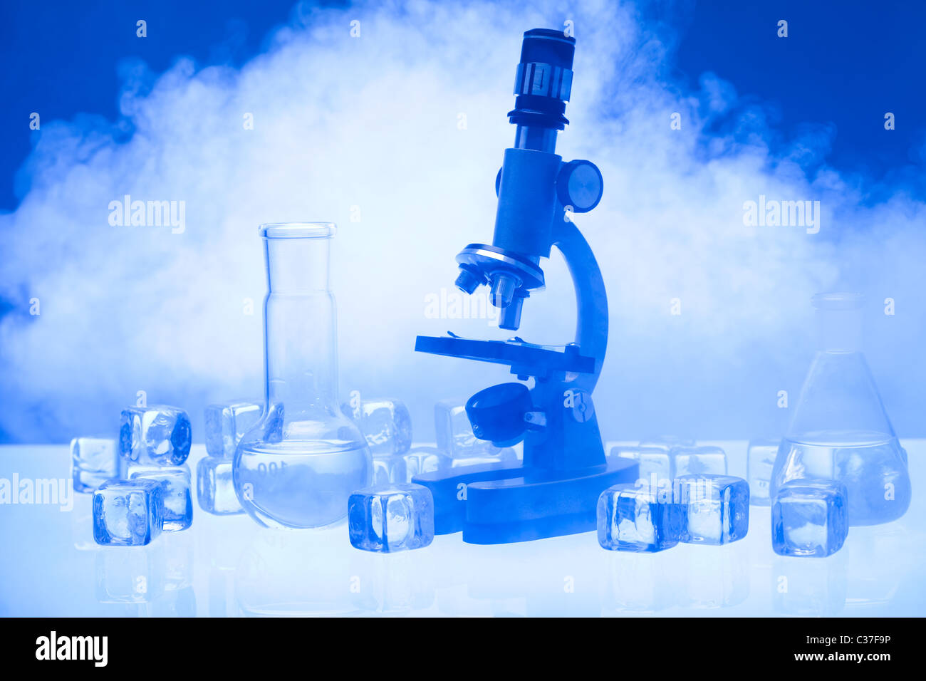 Laboratory glass in blue scenery Stock Photo - Alamy
