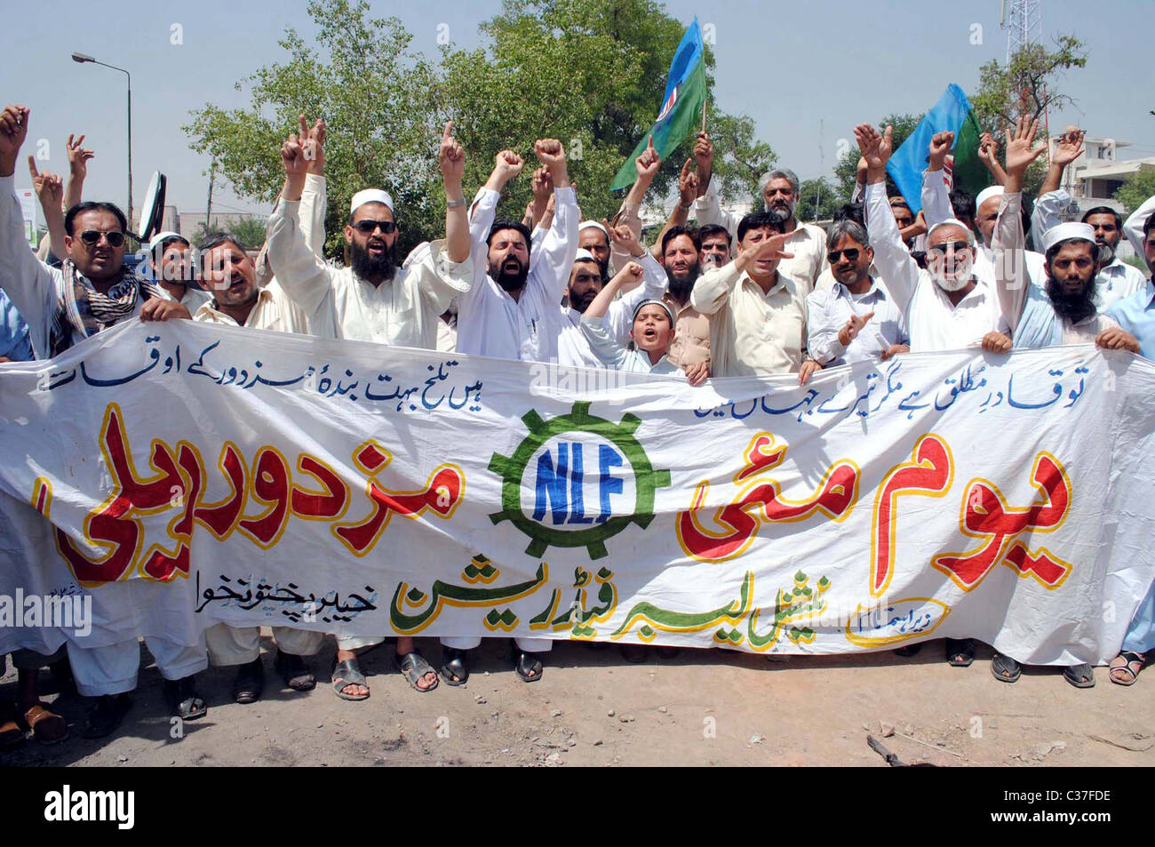 Members of National Labour Federation chant slogans in favor of labour ...