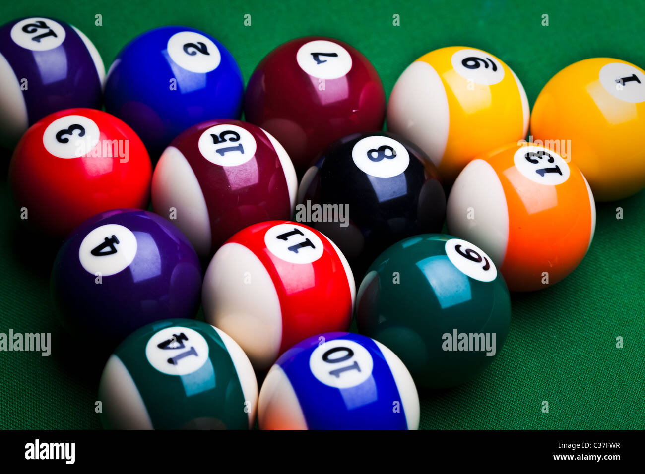 Billiard balls over green table Stock Photo - Alamy