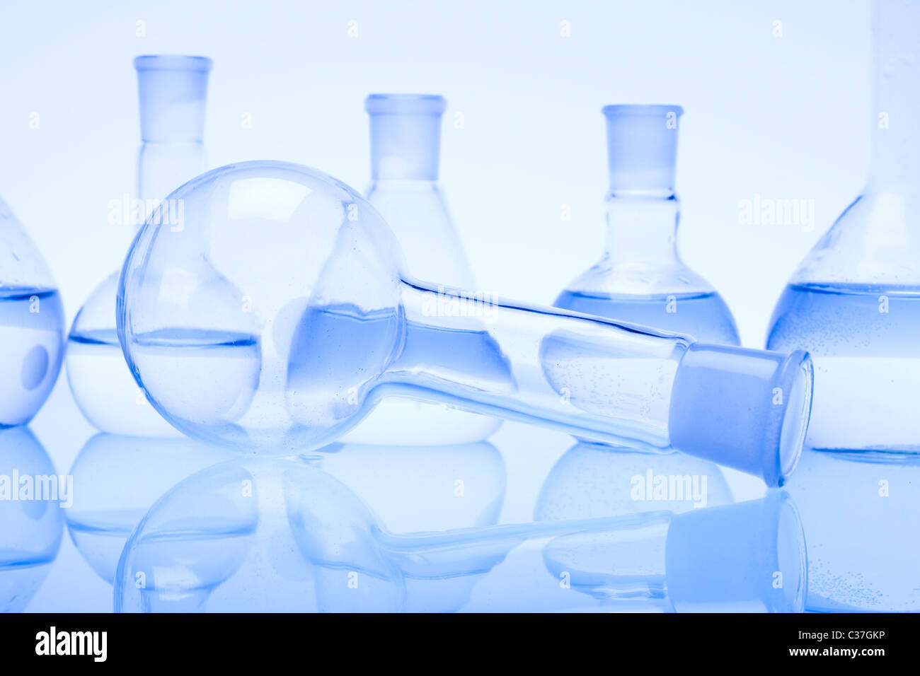 Laboratory glass in blue scenery Stock Photo - Alamy