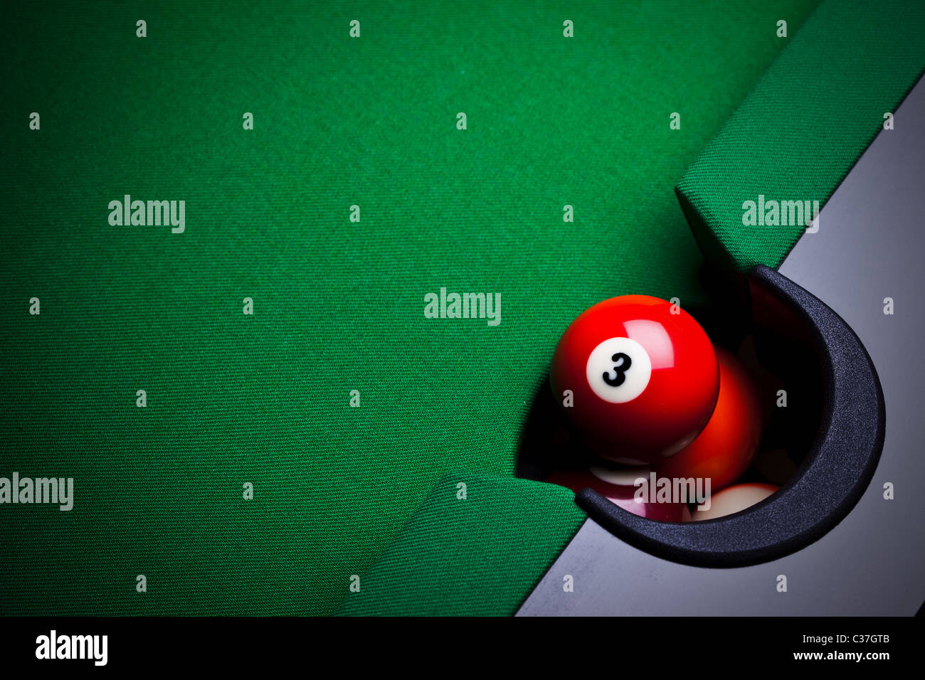 Billiard balls over green table Stock Photo - Alamy