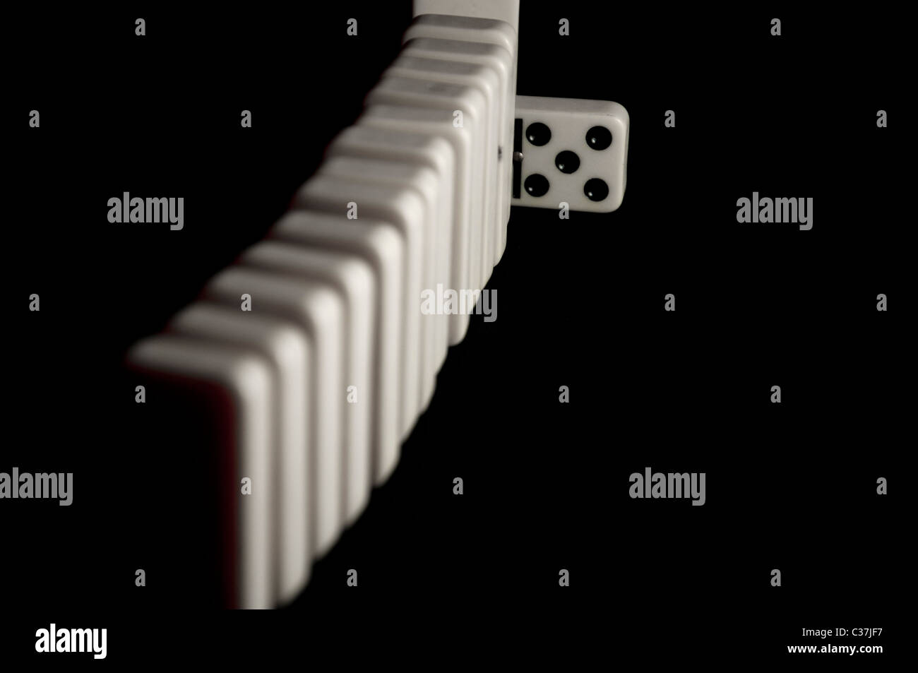 one domino standing out of the rest Stock Photo - Alamy
