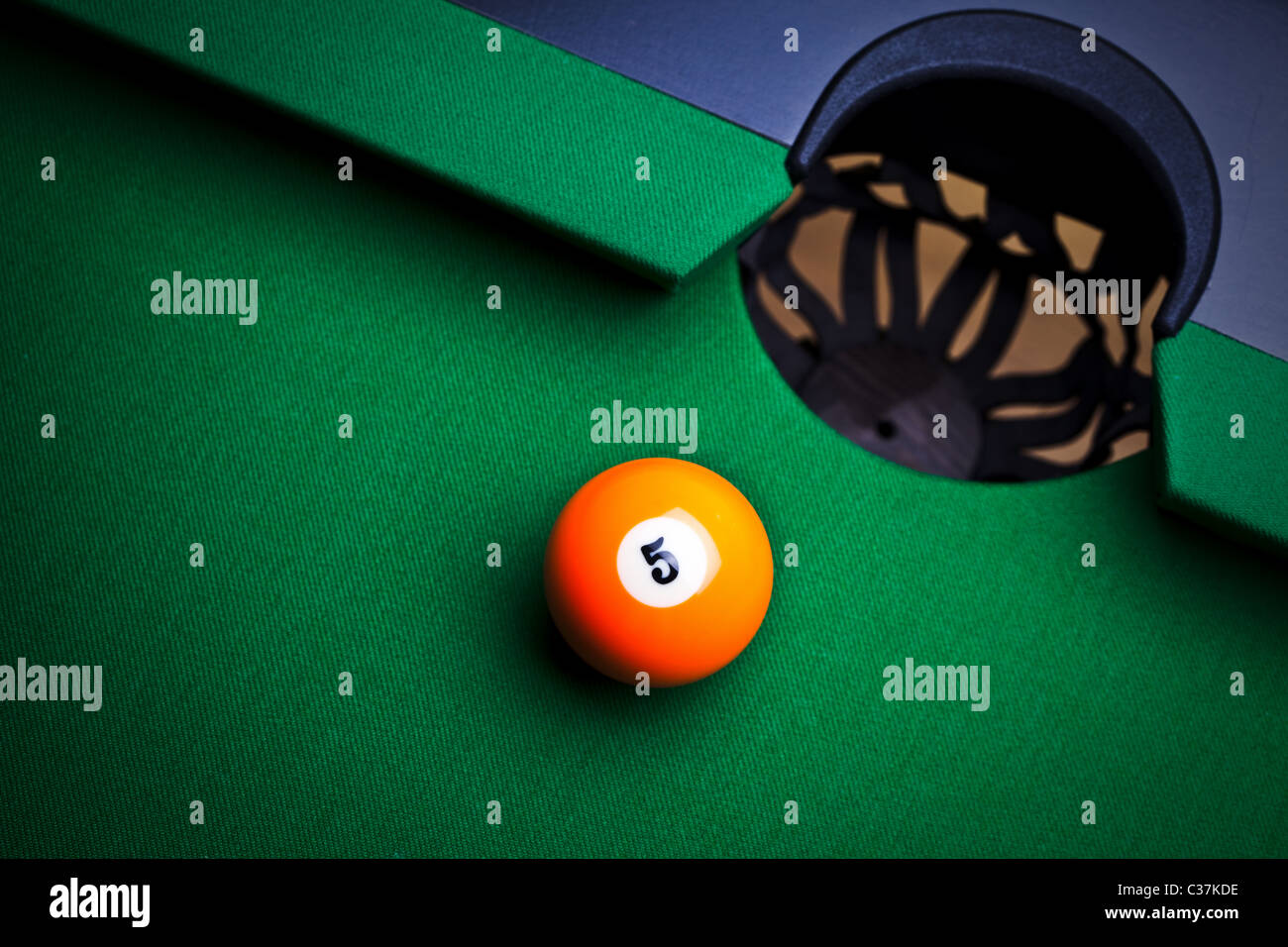 Billiard balls over green table Stock Photo - Alamy