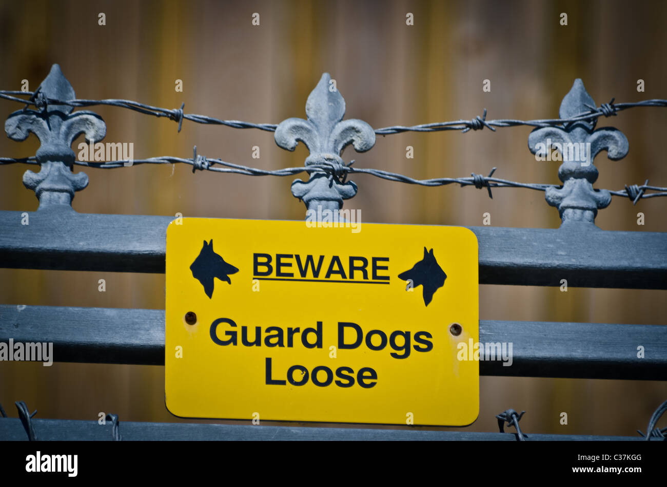 Beware Guard Dogs loose sign Stock Photo - Alamy