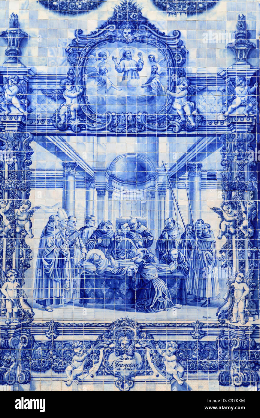 Azulejo tiles represent the death of St Francis of Asissi on the facade ...