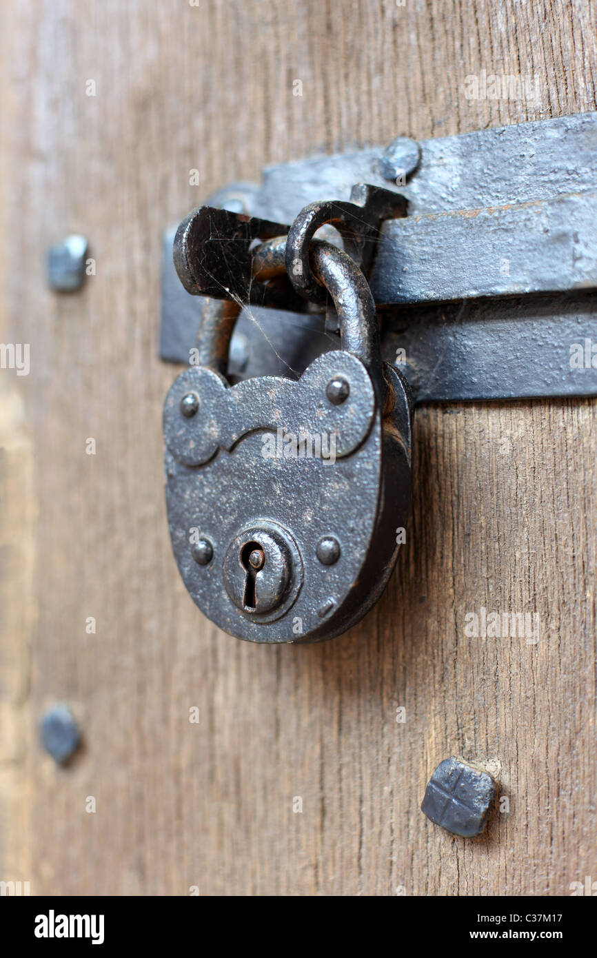 Ancient padlock at a wooden door Stock Photo - Alamy