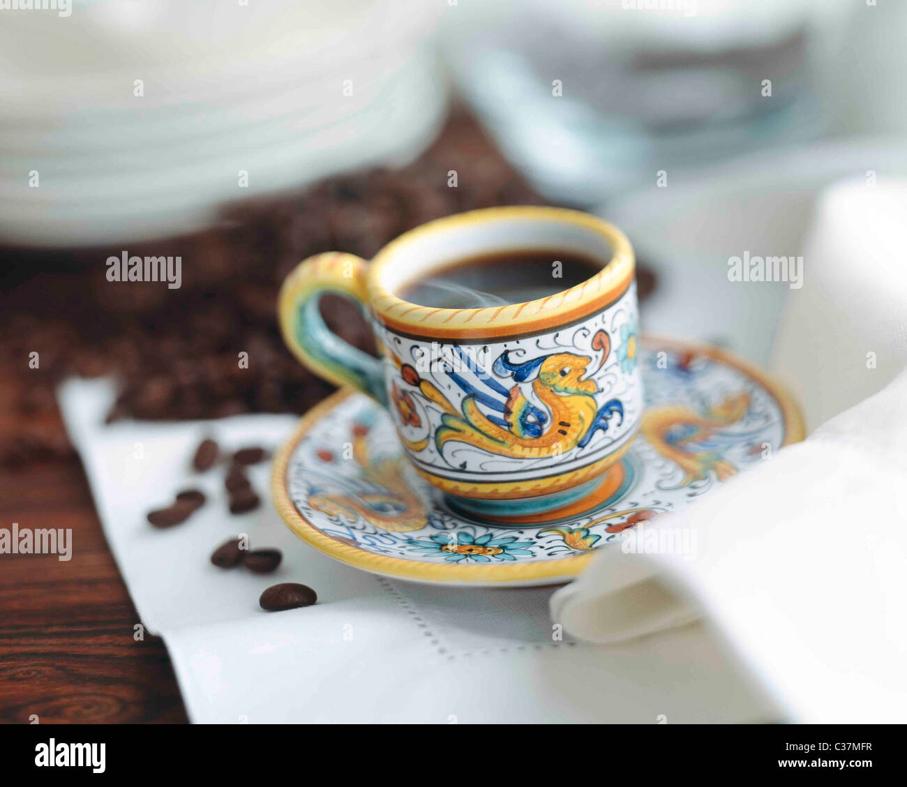 Demitasse espresso and beans Stock Photo - Alamy