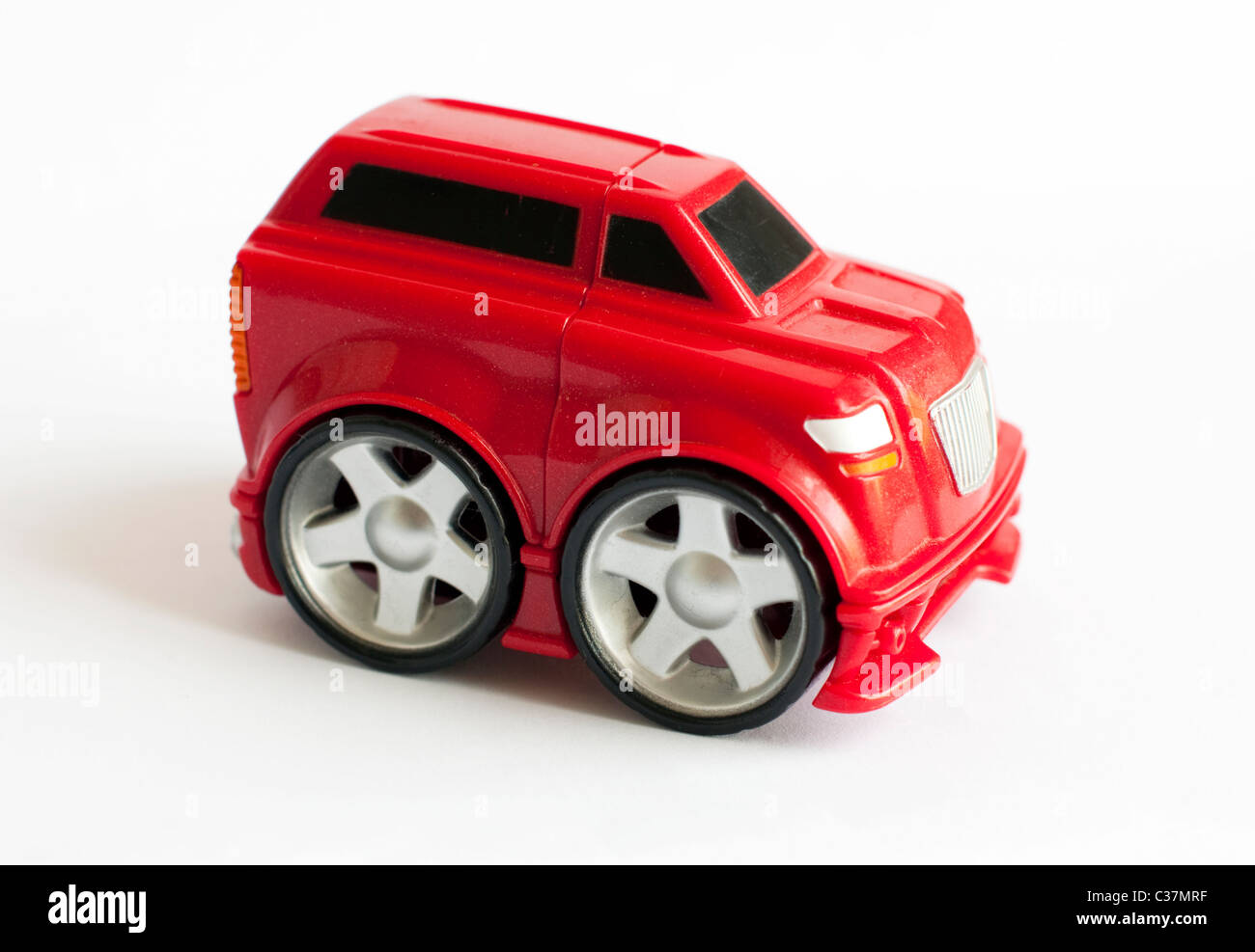 A red toy car isolated on white background Stock Photo - Alamy