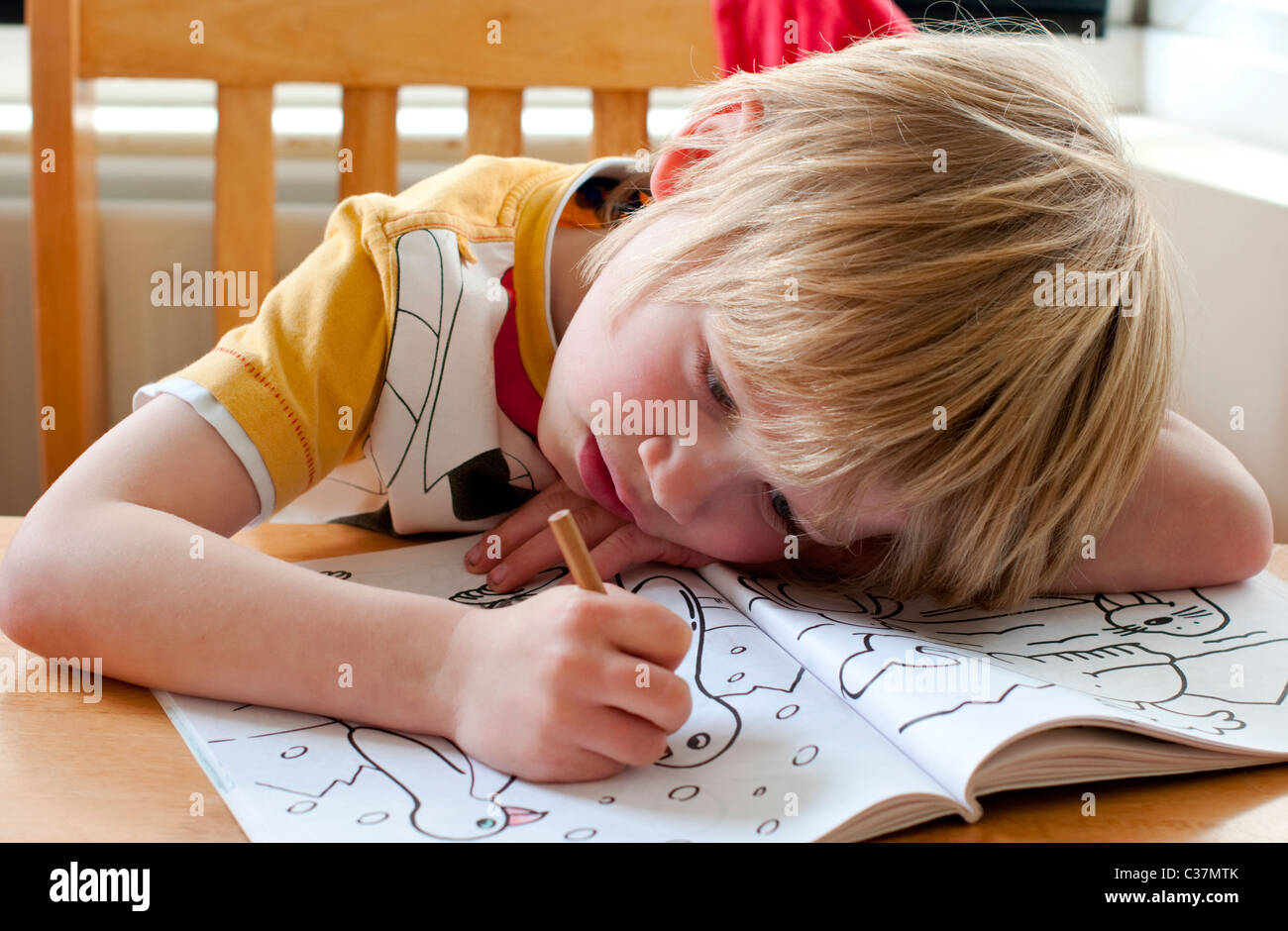 A boy drawing Stock Photo - Alamy