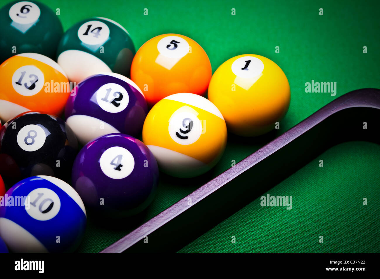 Billiard balls over green table Stock Photo - Alamy