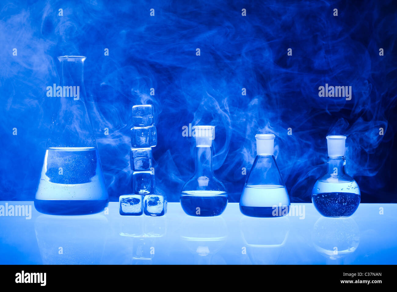 Laboratory glass in blue scenery Stock Photo - Alamy