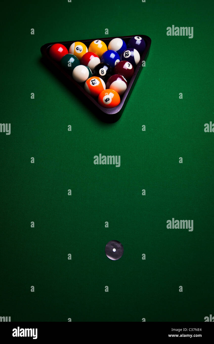 Billiard balls over green table Stock Photo - Alamy