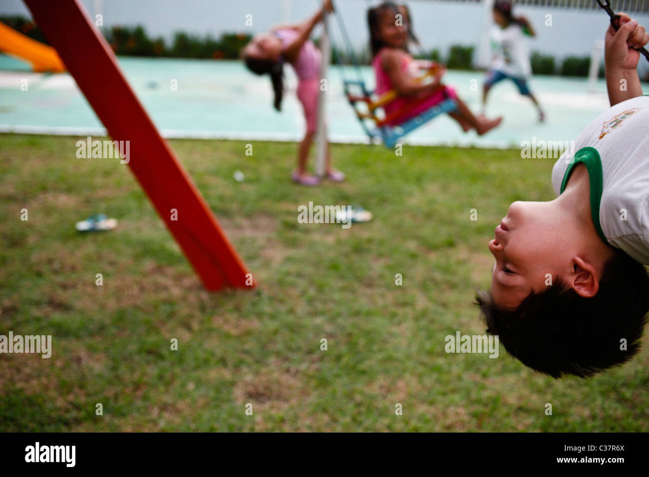 4-7-years old children playing together on a playground. Kids being ...