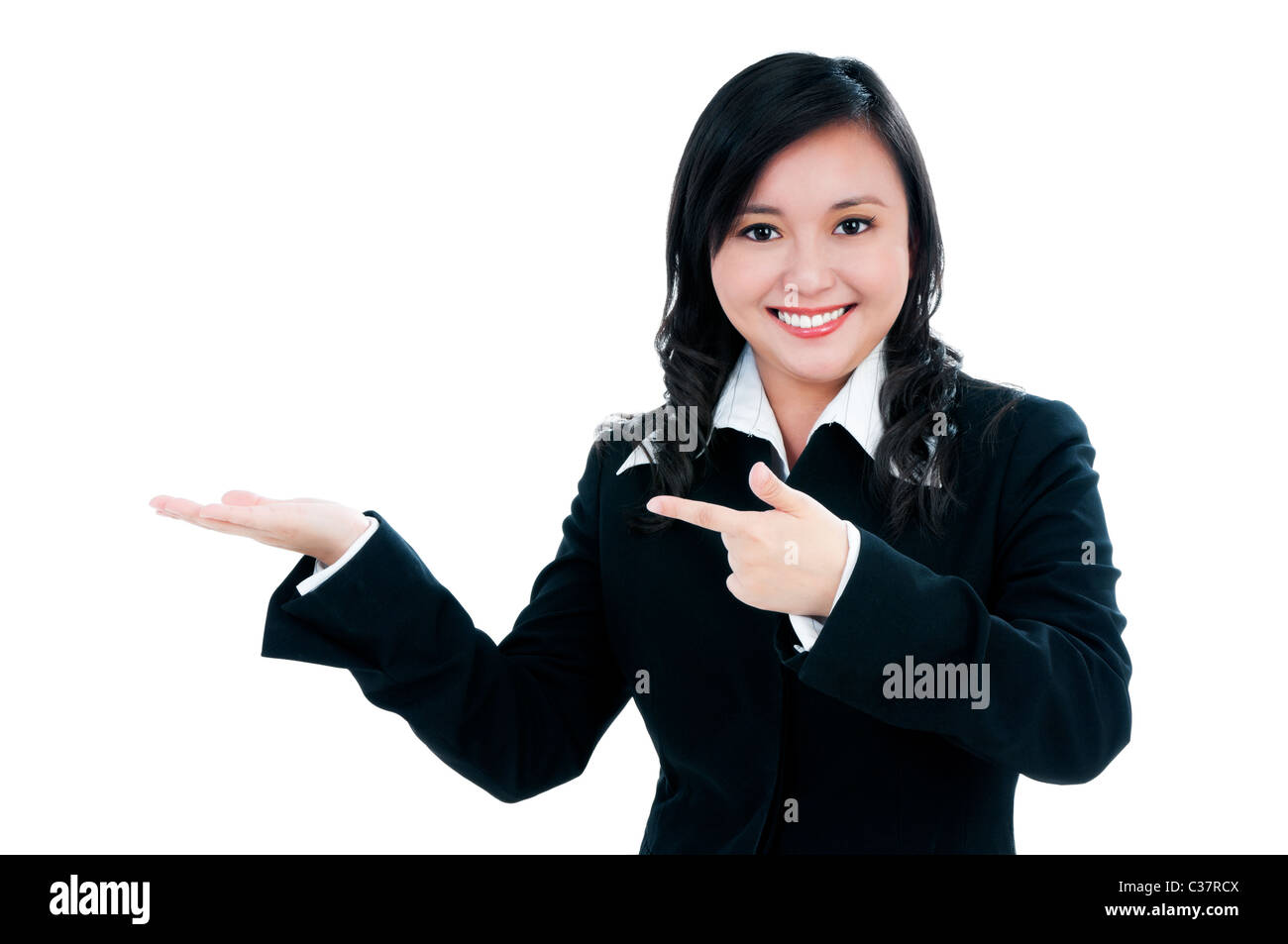 Beautiful young woman pointing and presenting things Stock Photo - Alamy