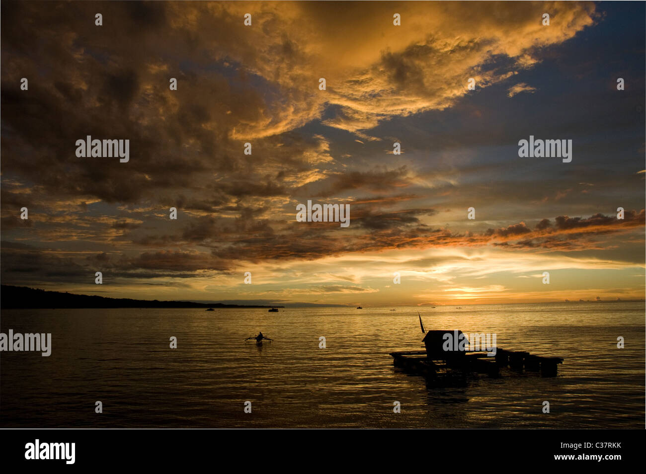 Sunset over the ocean in Sulawesi, Indonesia Stock Photo - Alamy