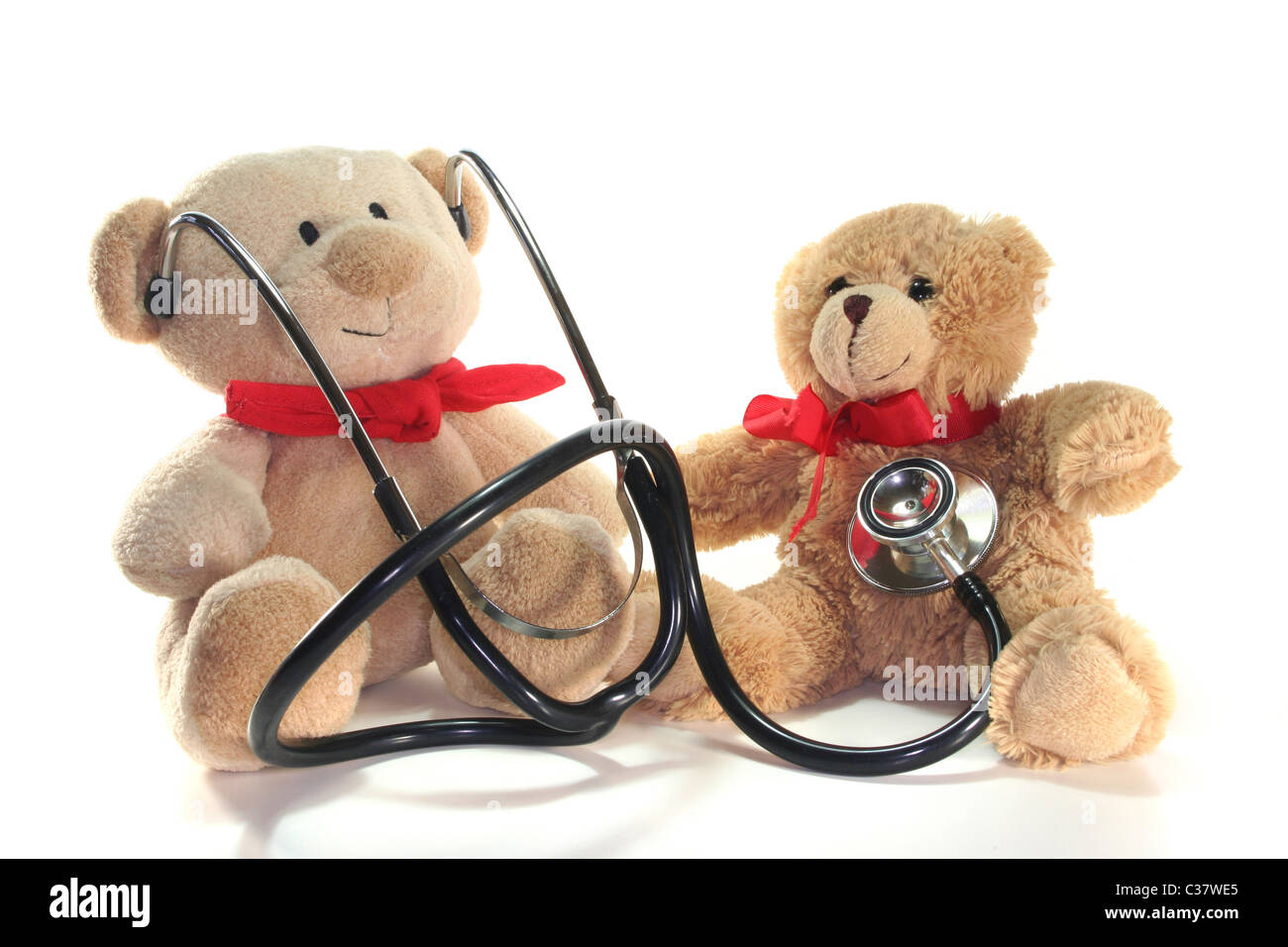 Teddy-doctor and Teddy-child listens on a white background Stock Photo ...