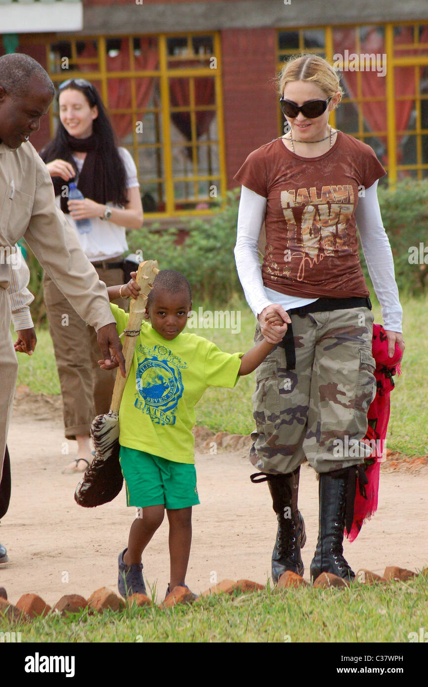 Madonna and her adopted son David Banda, during a visit to the children ...
