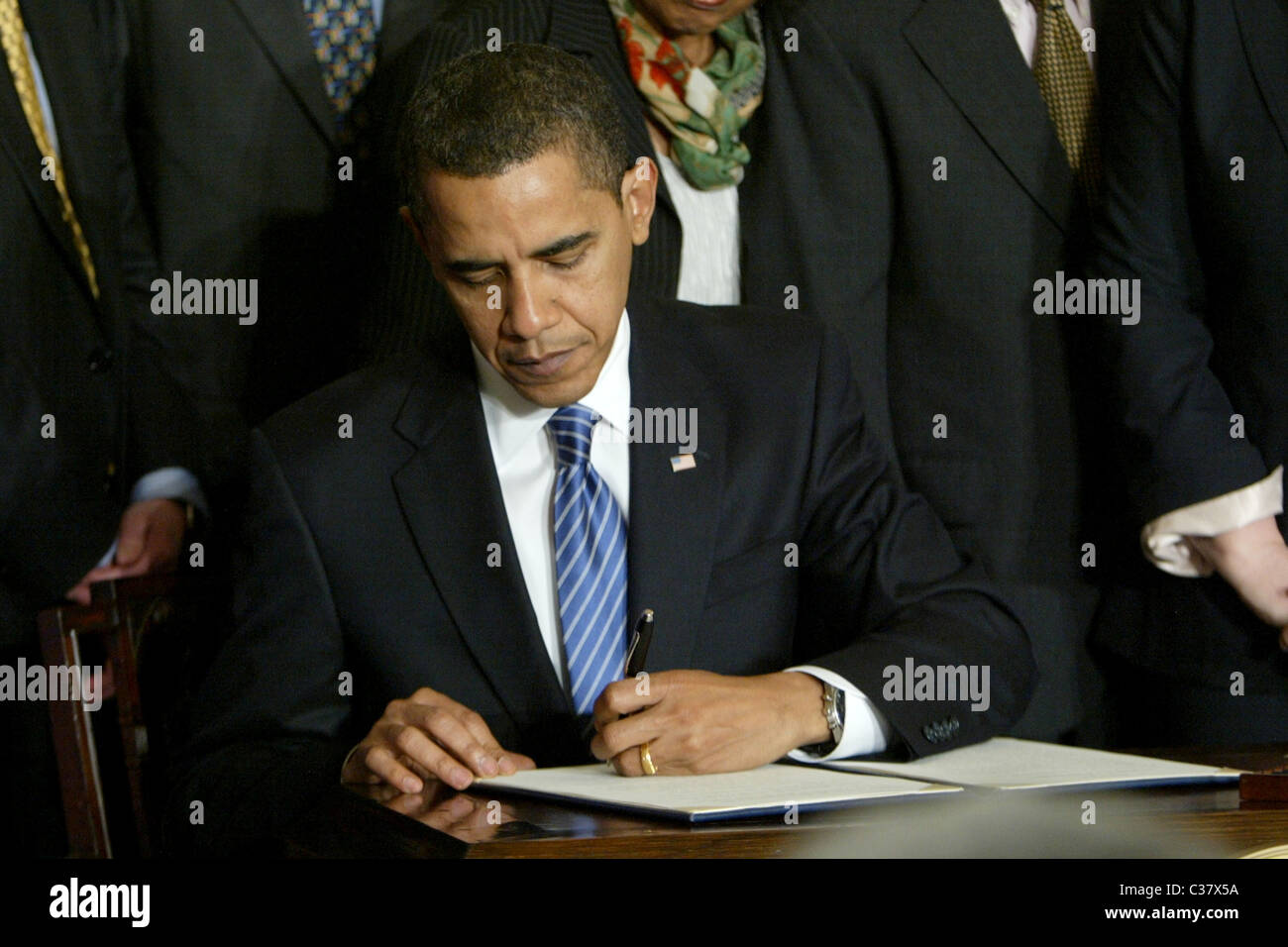 President Barack Obama signs an Executive Order on stem cells and a ...