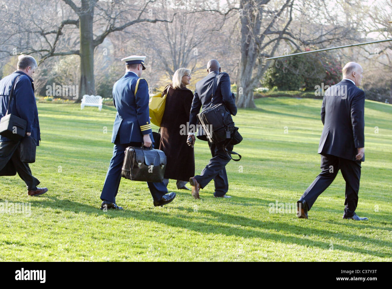 US President Barack Obama's staff walk to Marine One at the White House ...