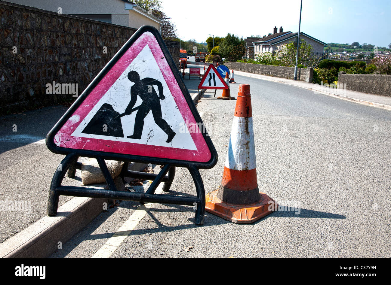 Series of road signs warning of road works, the narrowing of the ...