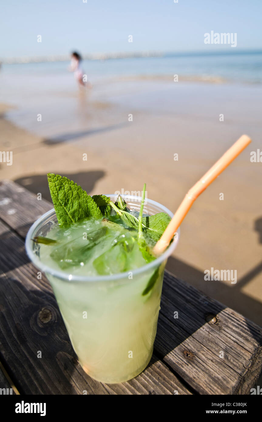 A cold Lemonana (Lemonade with mint ) drink served on the beach of Tel ...