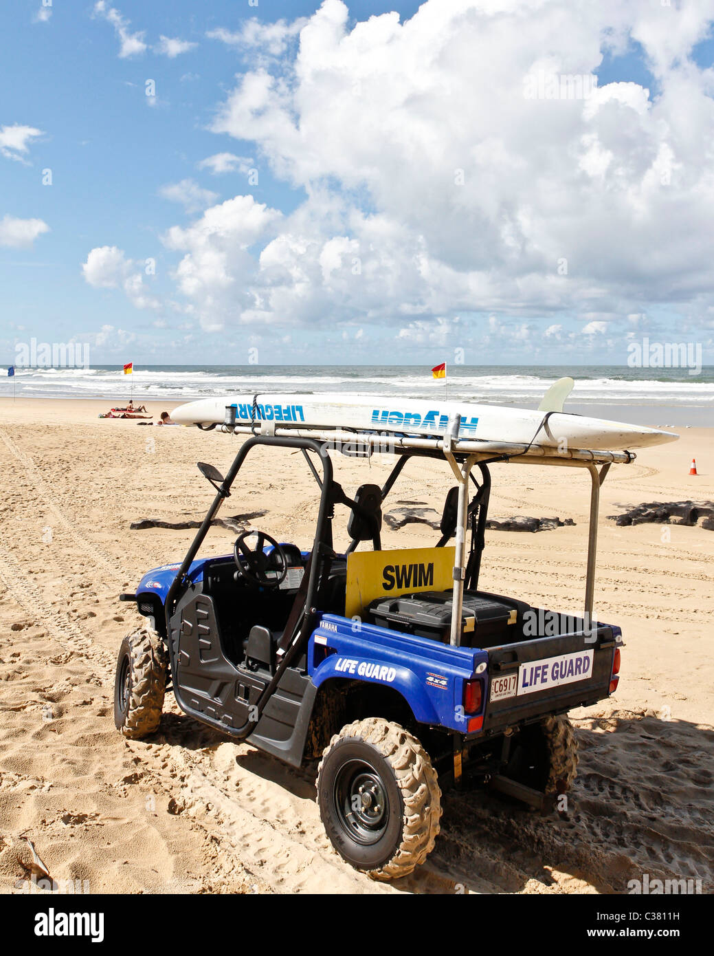 Lifeguard rescue vehicle on beach with gathering storm clouds Stock ...