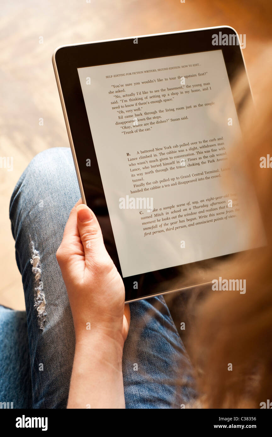 woman reading an e-book with iPad Stock Photo - Alamy