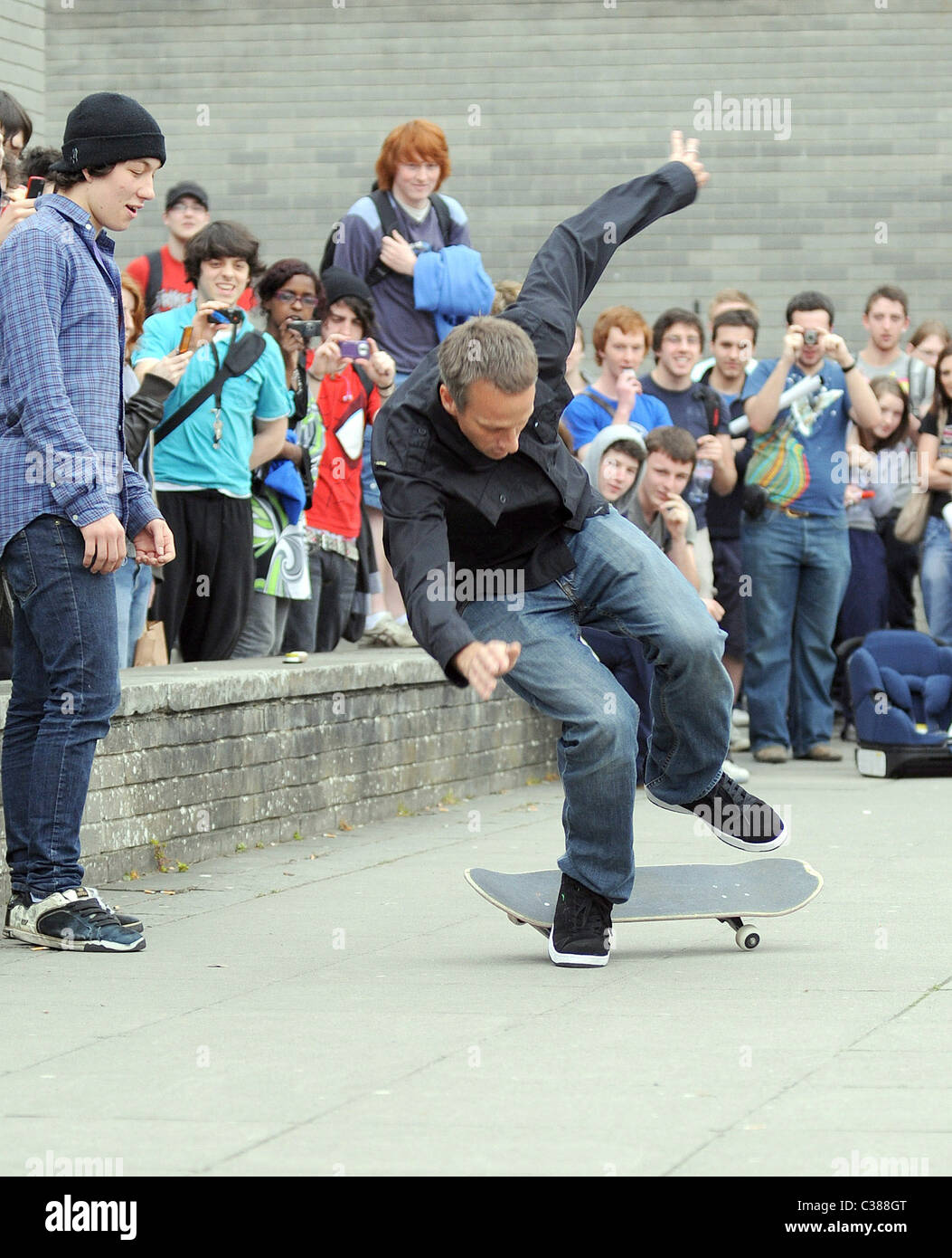 skateboarder Tony Hawk shows off some of his moves before receiving the ...
