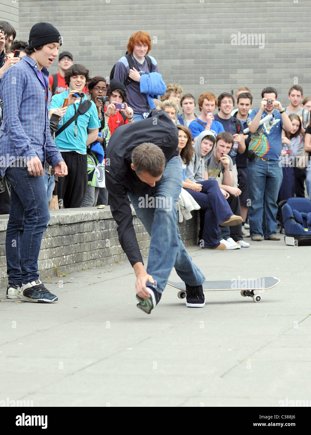 skateboarder Tony Hawk shows off some of his moves before receiving the ...