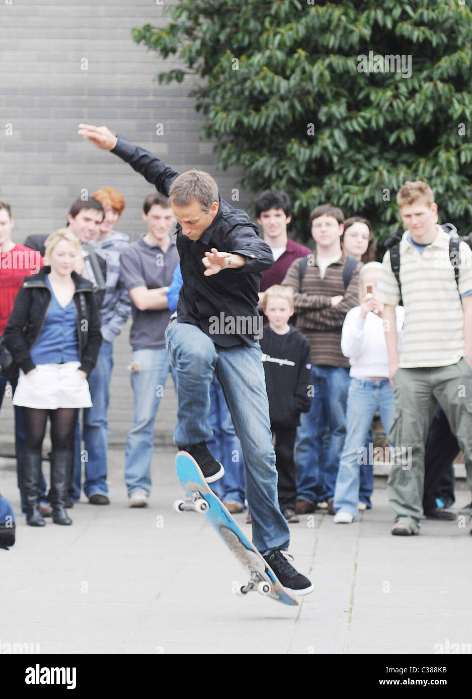 skateboarder Tony Hawk shows off some of his moves before receiving the ...