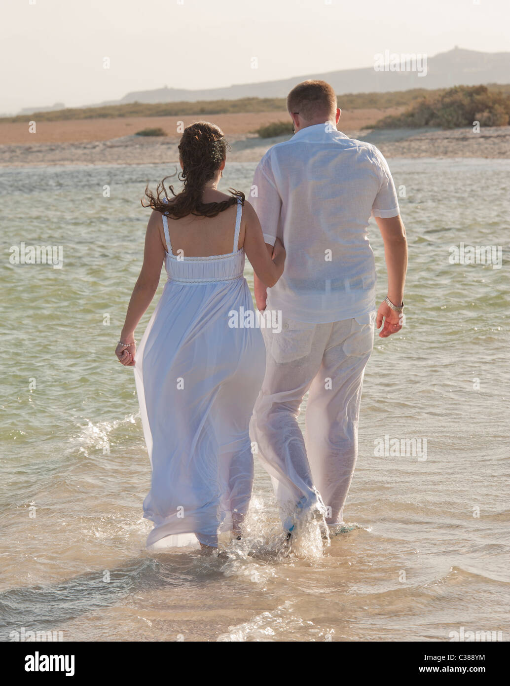 Woman wading in water in a dress hi-res stock photography and images ...