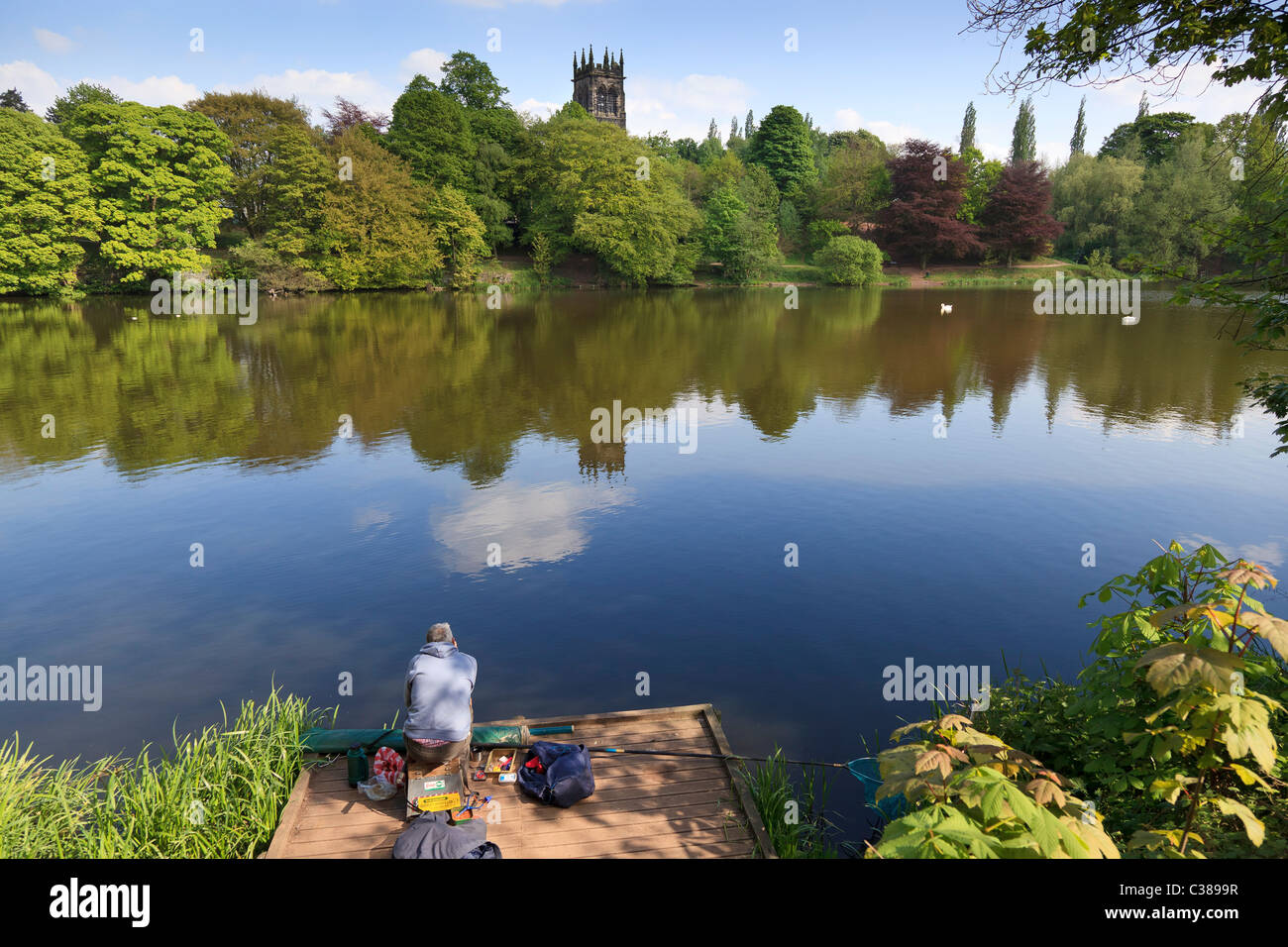 St. Mary's church above Lymm dam with a lone angler fishing Stock Photo ...