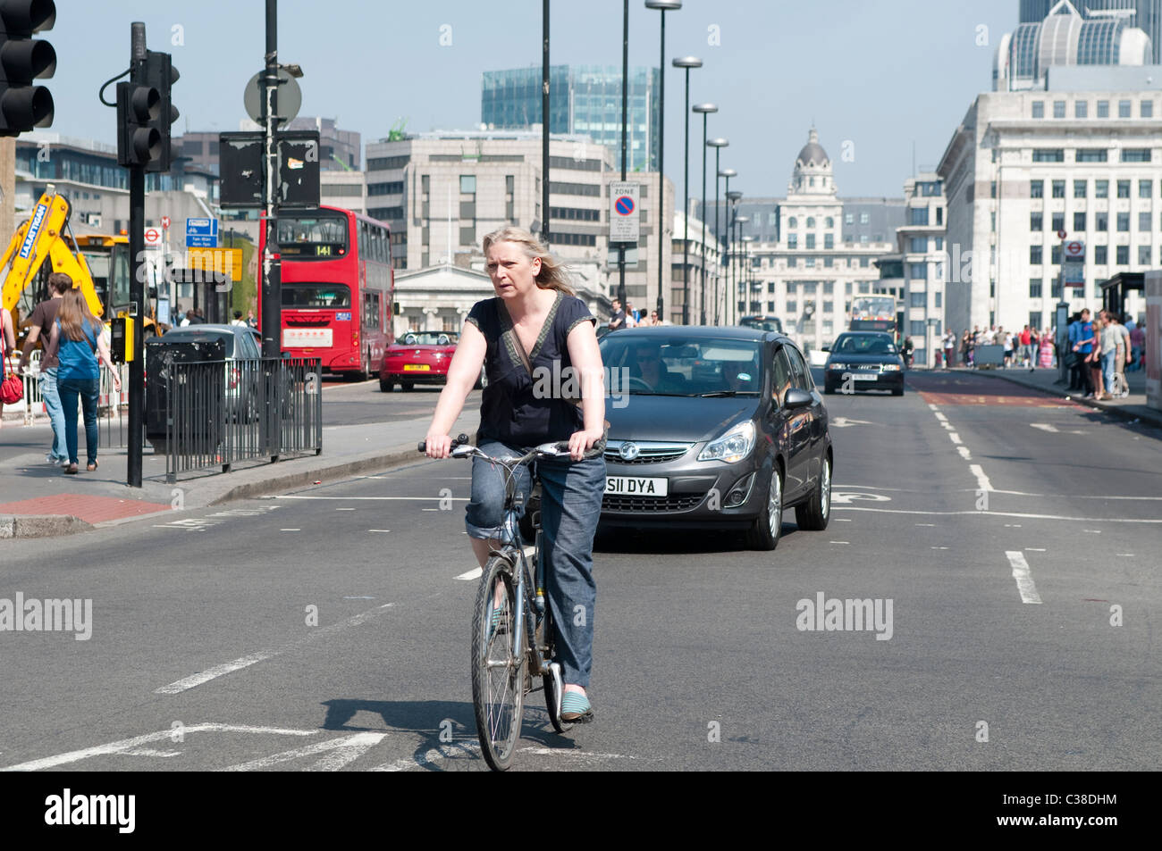 Female cyclist on London Bridge, A3, London, UK Stock Photo - Alamy
