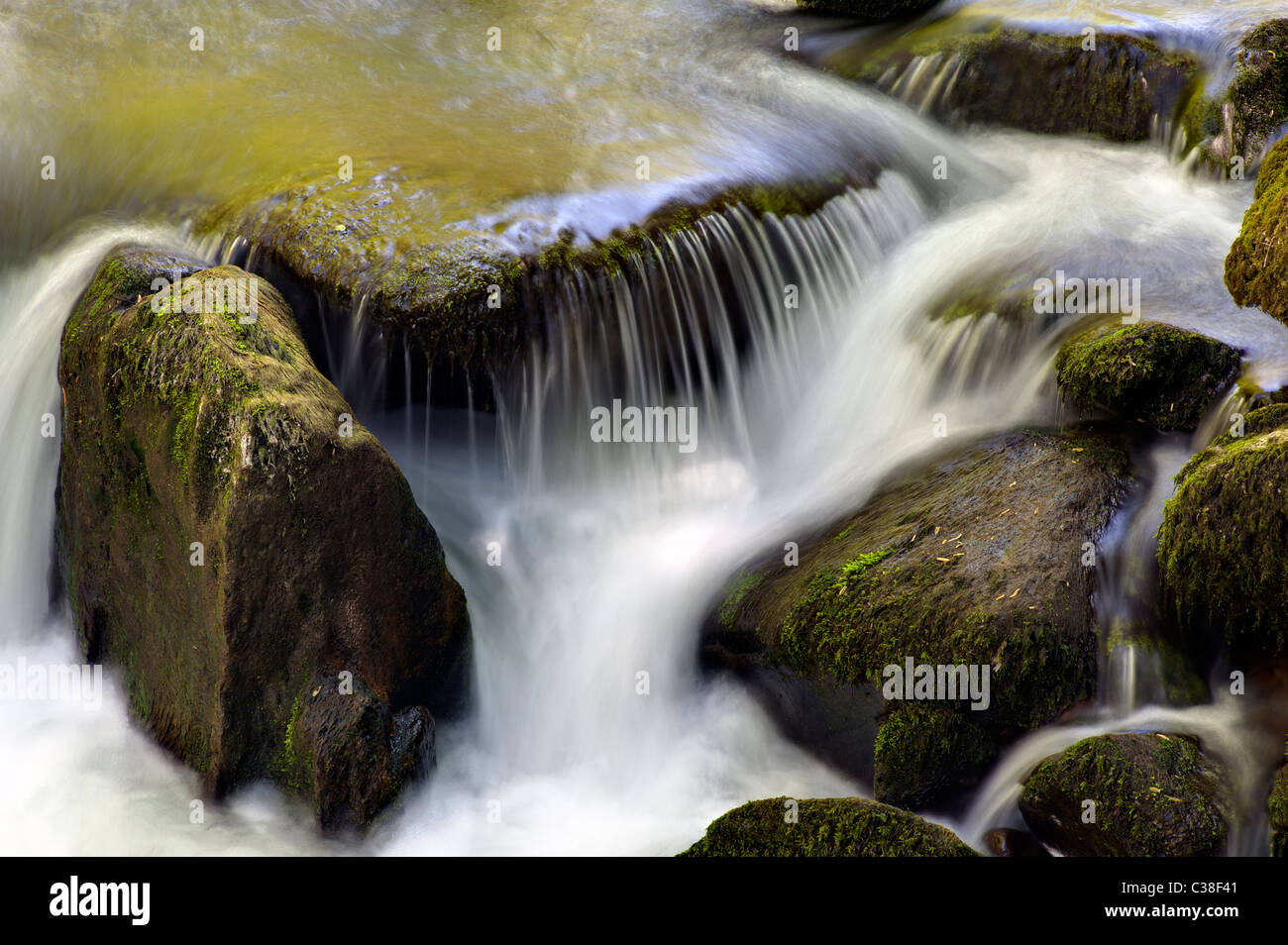 Water flowing over stones hi-res stock photography and images - Alamy