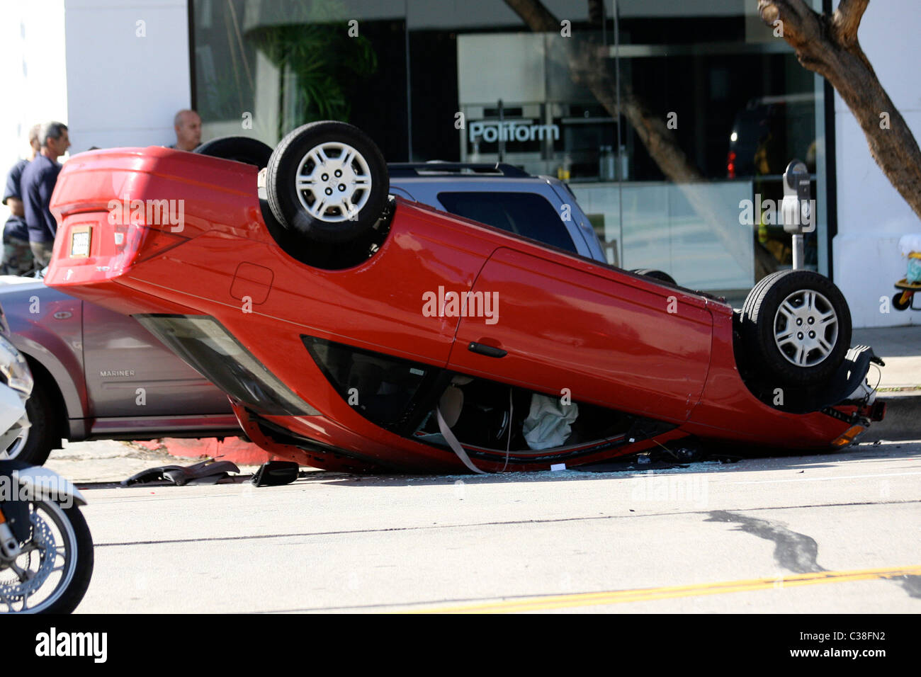 Atmosphere A Honda Civic lies upside down after a collision on ...