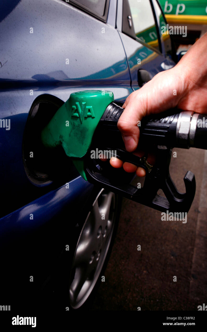 A man refueling his car at a BP petrol station Stock Photo - Alamy